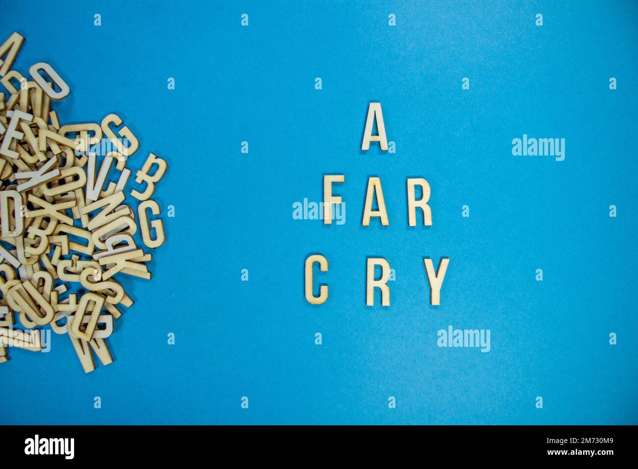 A FAR CRY in wooden English language capital letters spilling from a ...