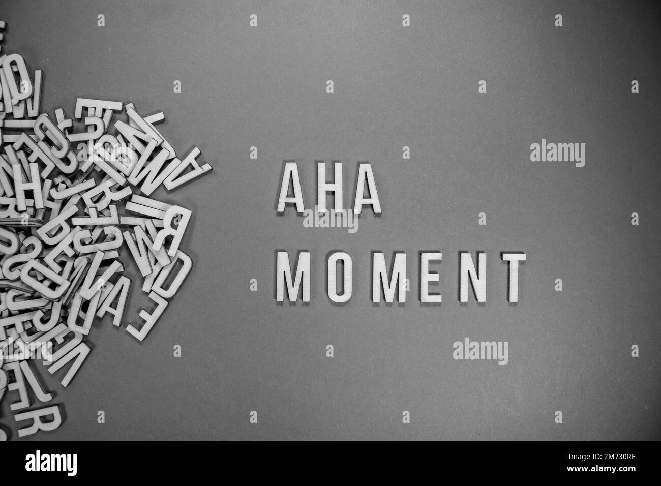 AHA MOMENT in wooden English words language capital letters spilling ...