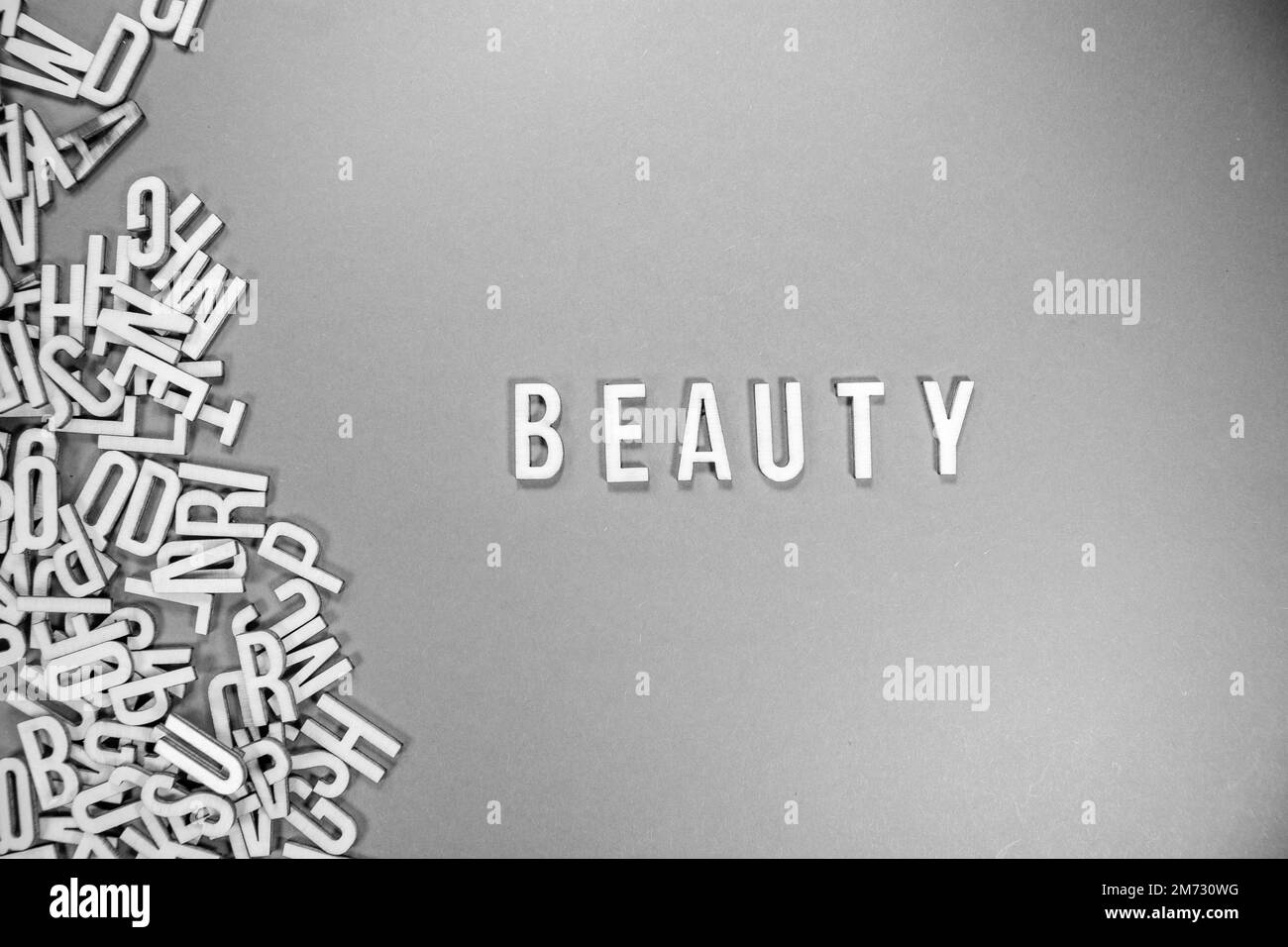 BEAUTY in wooden English words language capital letters spilling from a ...