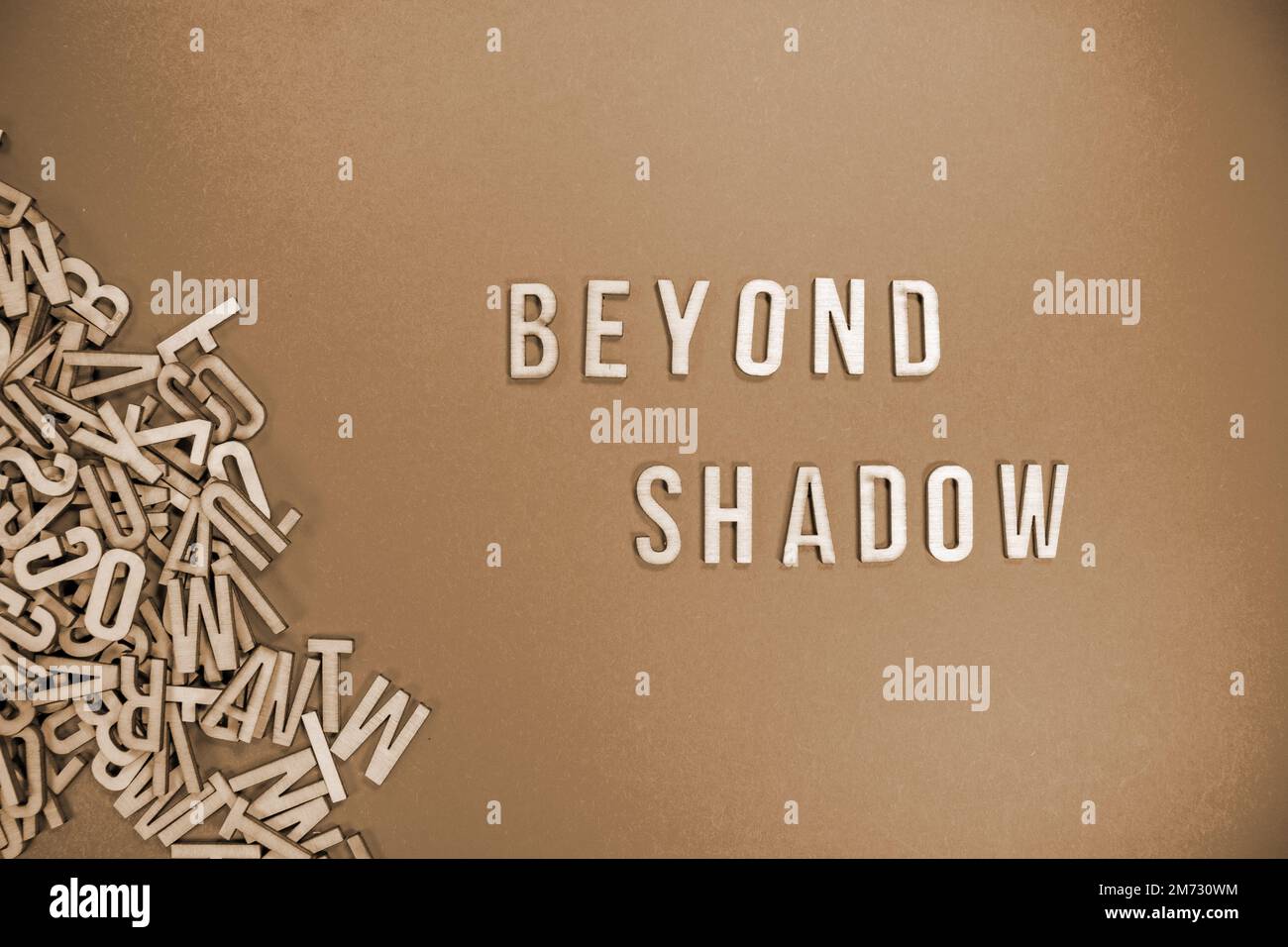 BEYOND SHADOW in wooden English words language capital letters spilling ...