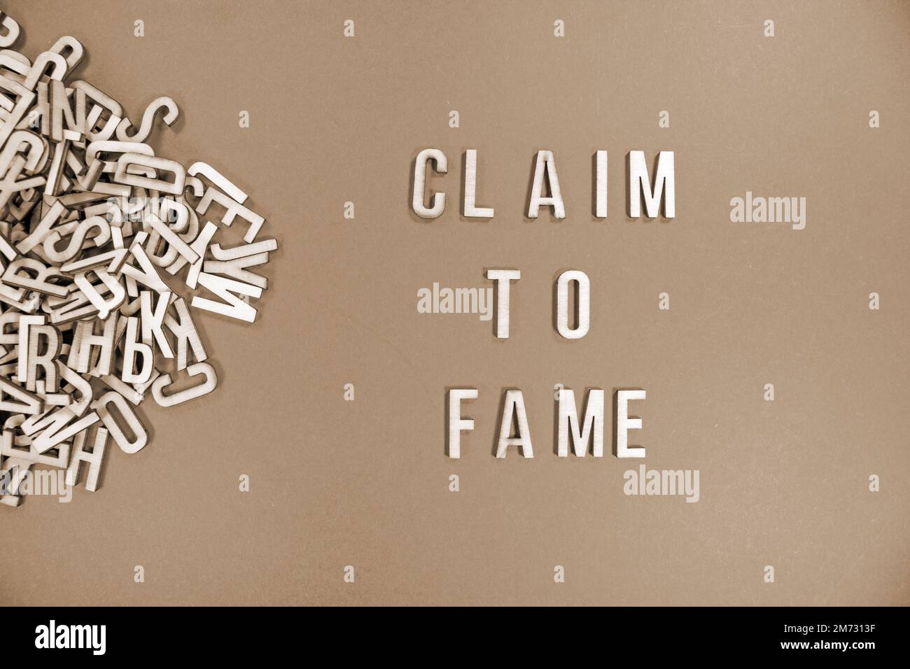 CLAIM TO FAME in wooden English language capital letters spilling from ... CLAIM TO FAME in wooden English language capital letters spilling from ...