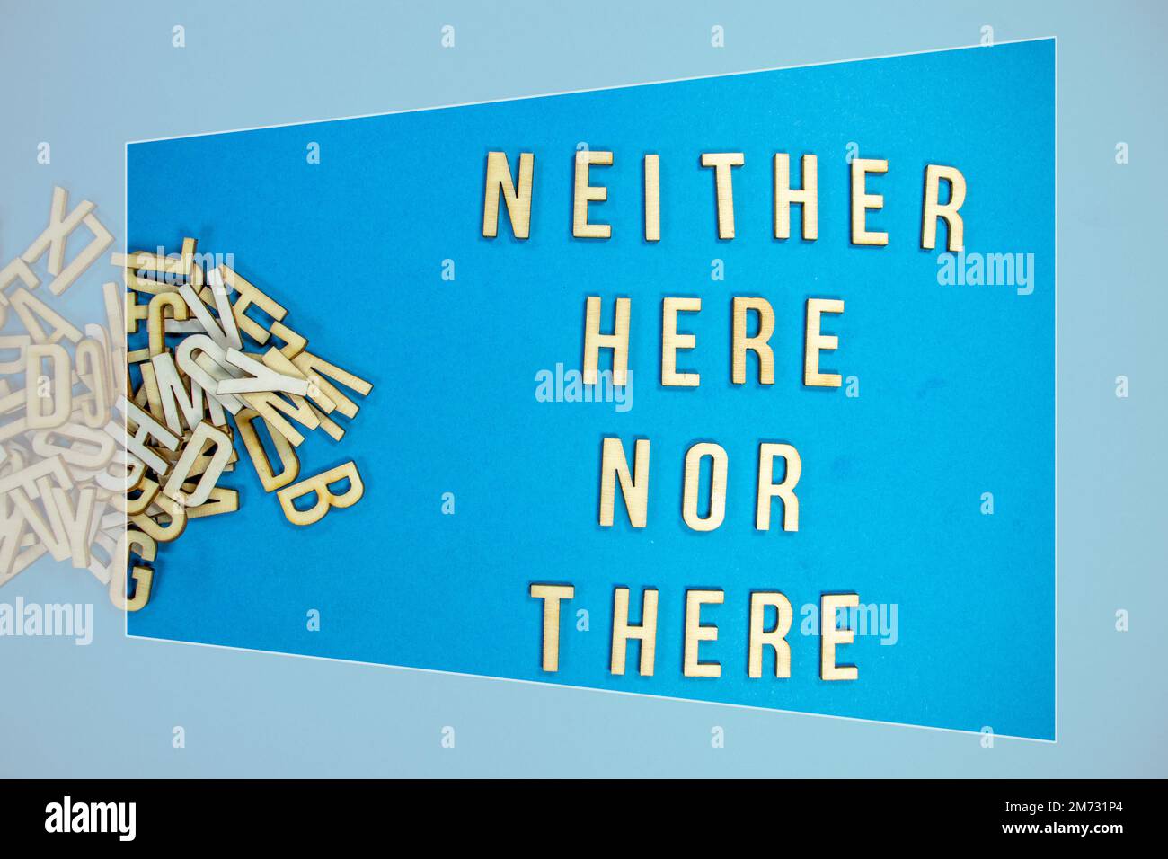NEITHER HERE NOR THERE in wooden English language capital letters ...
