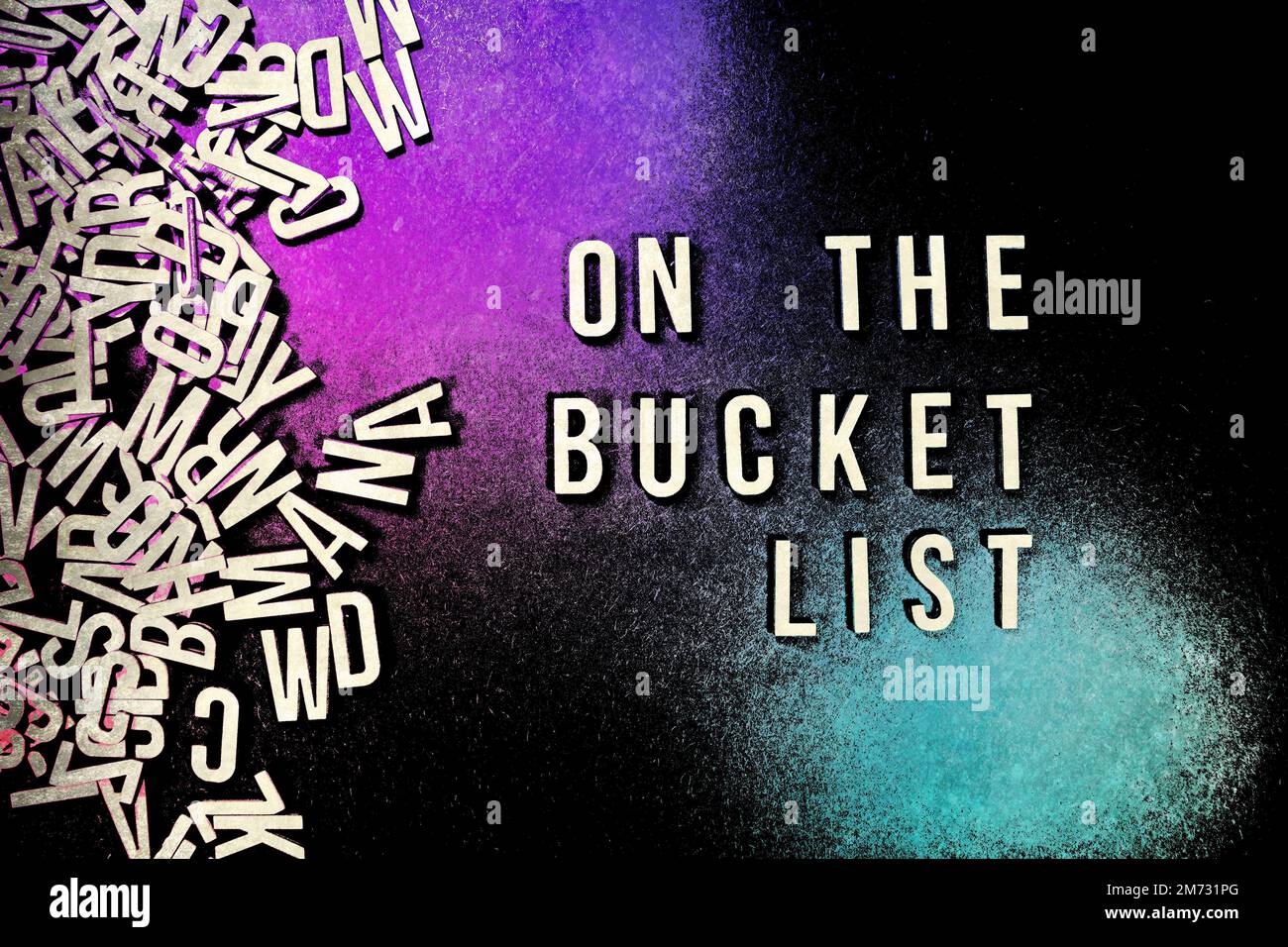 ON THE BUCKET LIST in wooden English language capital letters spilling ...
