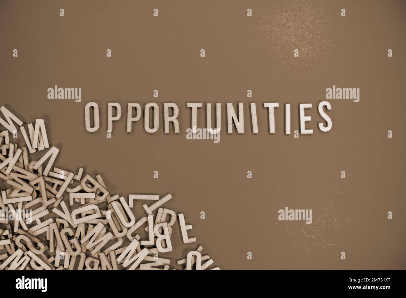 OPPORTUNITIES in wooden English words language capital letters spilling ...