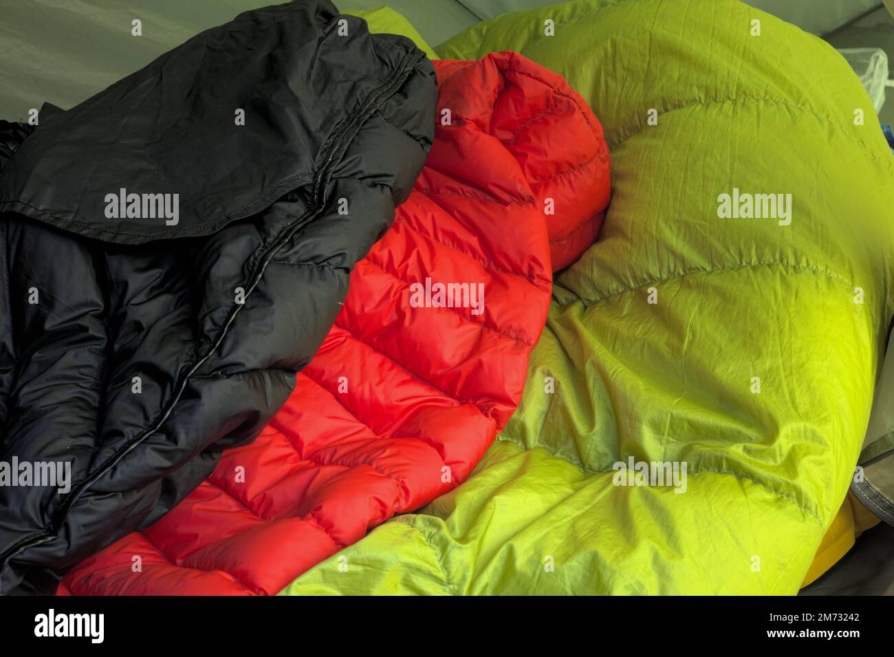 colorful down clothes (trouser, jacket and sleeping bag) to sleep in ...