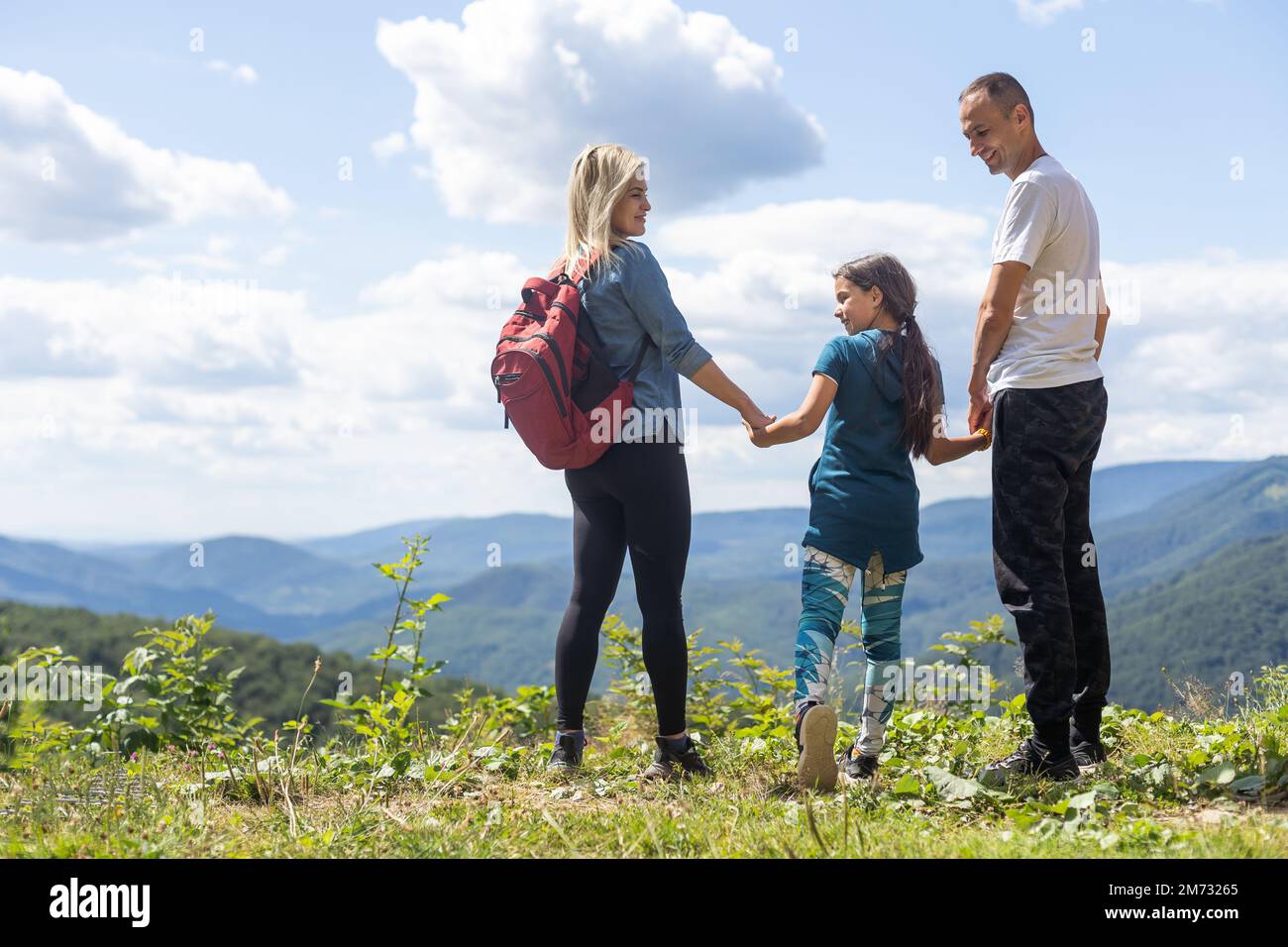Happy family: mother, father, child daughter on nature Stock Photo - Alamy