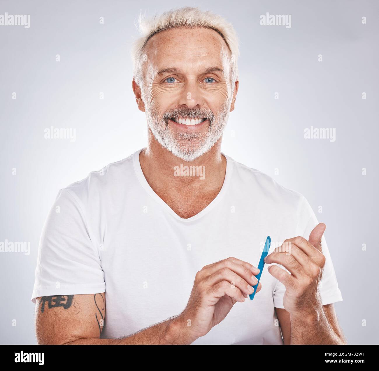 Man filing his nails hi-res stock photography and images - Alamy