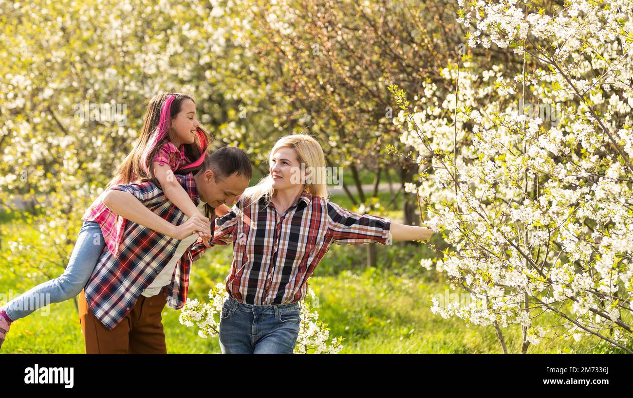 Young family with child having fun in nature Stock Photo - Alamy