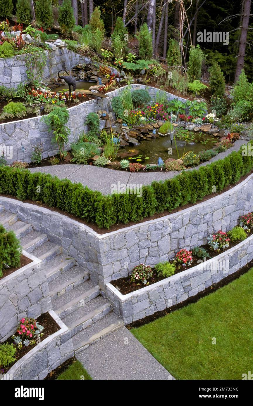 A stone retaining wall in a landscaped garden in Vancouver, British ...