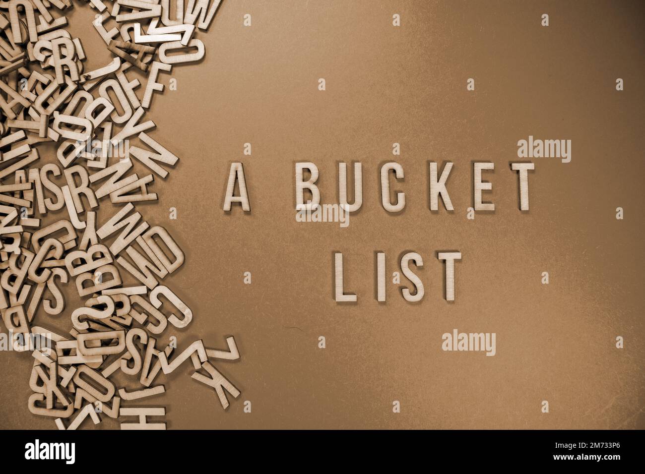 A BUCKET LIST in wooden English words language capital letters spilling ...