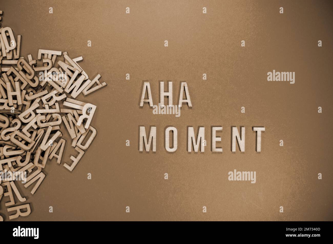 AHA MOMENT in wooden English words language capital letters spilling ...