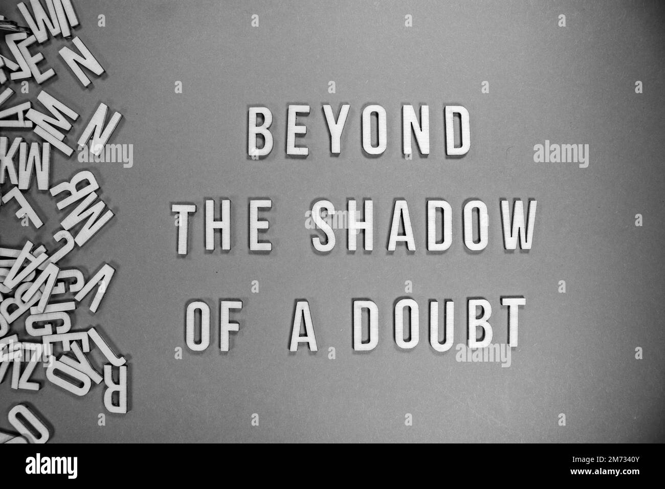 BEYOND THE SHADOW OF A DOUBT in wooden English language capital letters ...