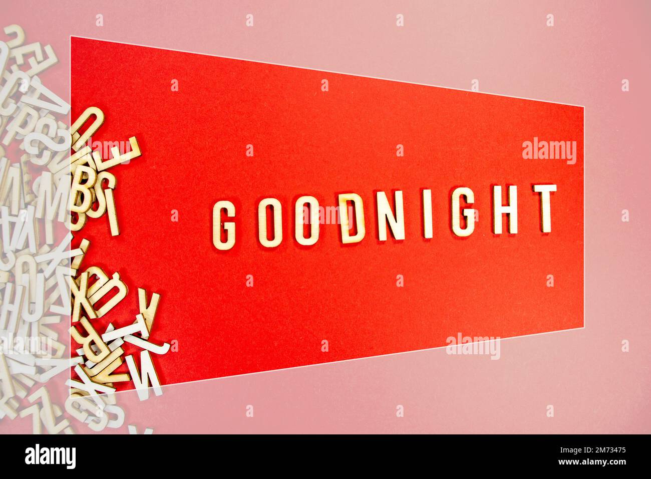 GOODNIGHT in wooden English language capital letters spilling from a ...