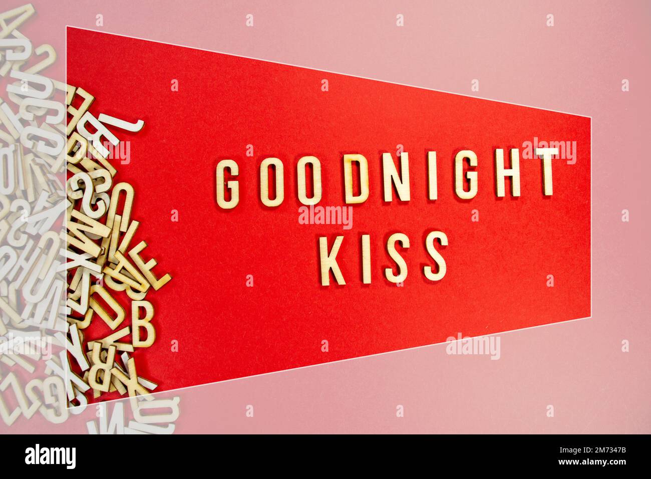 GOODNIGHT KISS in wooden English language capital letters spilling from ...