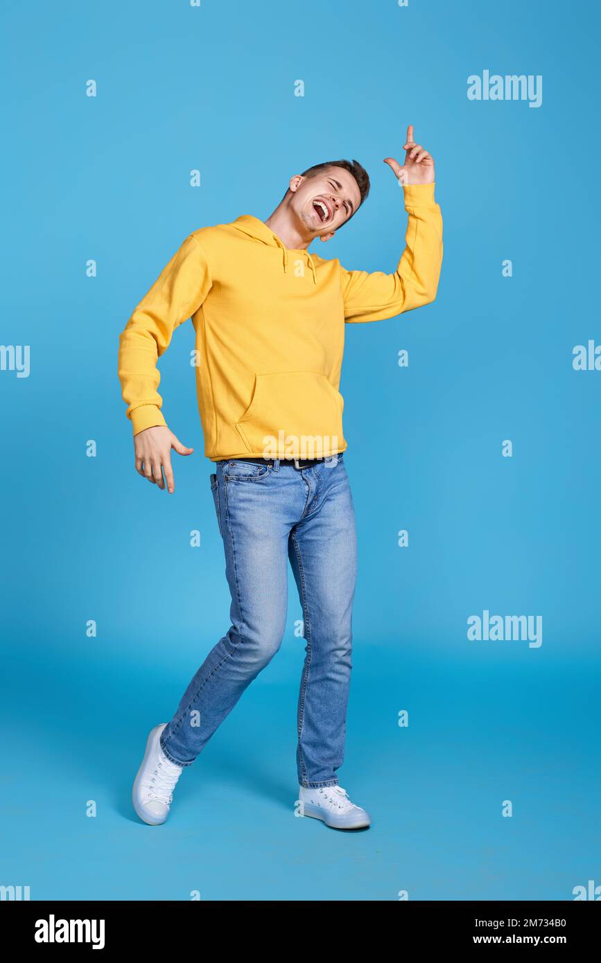 Happy male tourist dancing on hi-res stock photography and images - Alamy