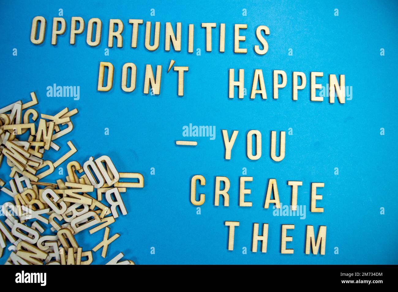 OPPORTUNITIES DONT HAPPEN YOU CREATE THEM in wooden English words ...