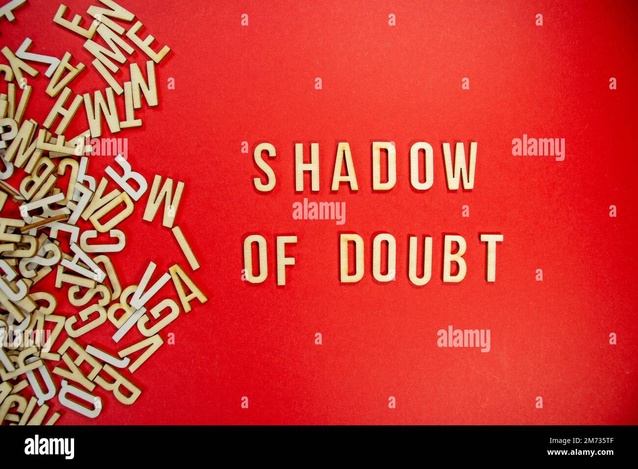 SHADOW OF DOUBT in wooden English words language capital letters ...