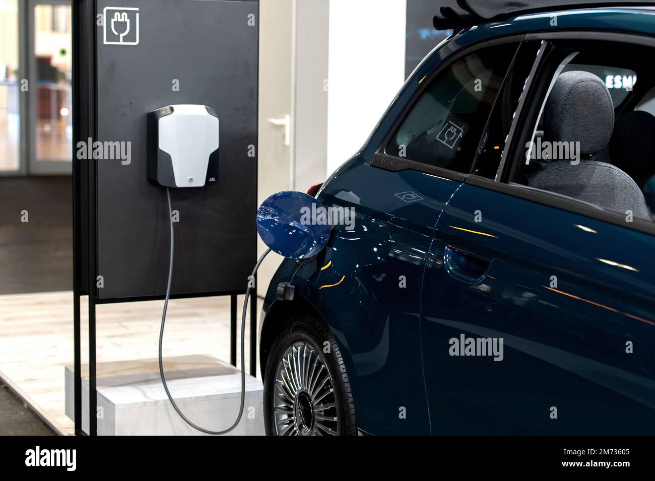 Riga,Latvia - April 29, 2022: Power supply plugged into electric car ...