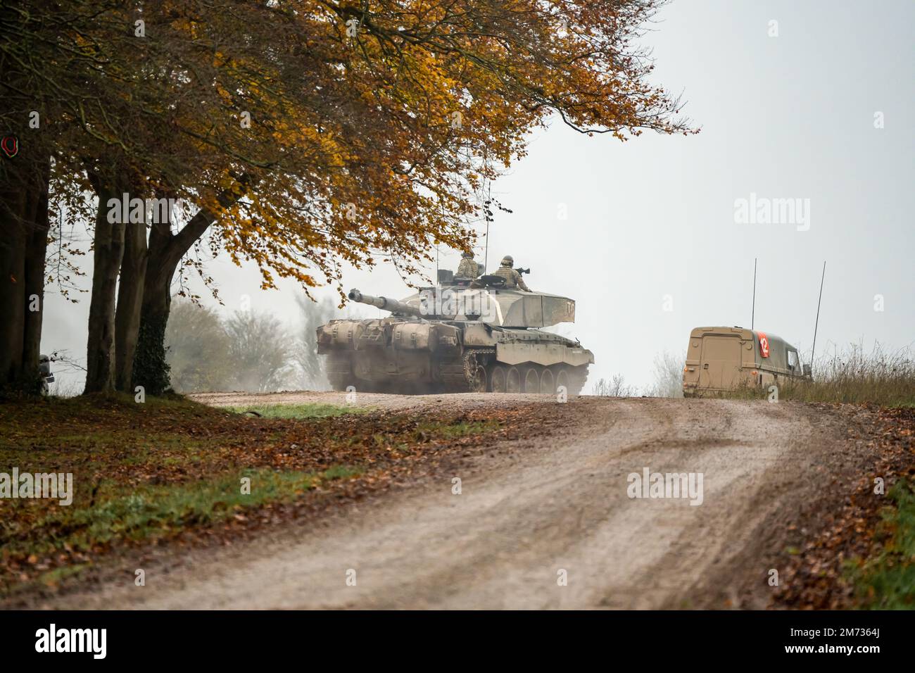 rear three-quarter view of a commander and gunner directing action on a ...