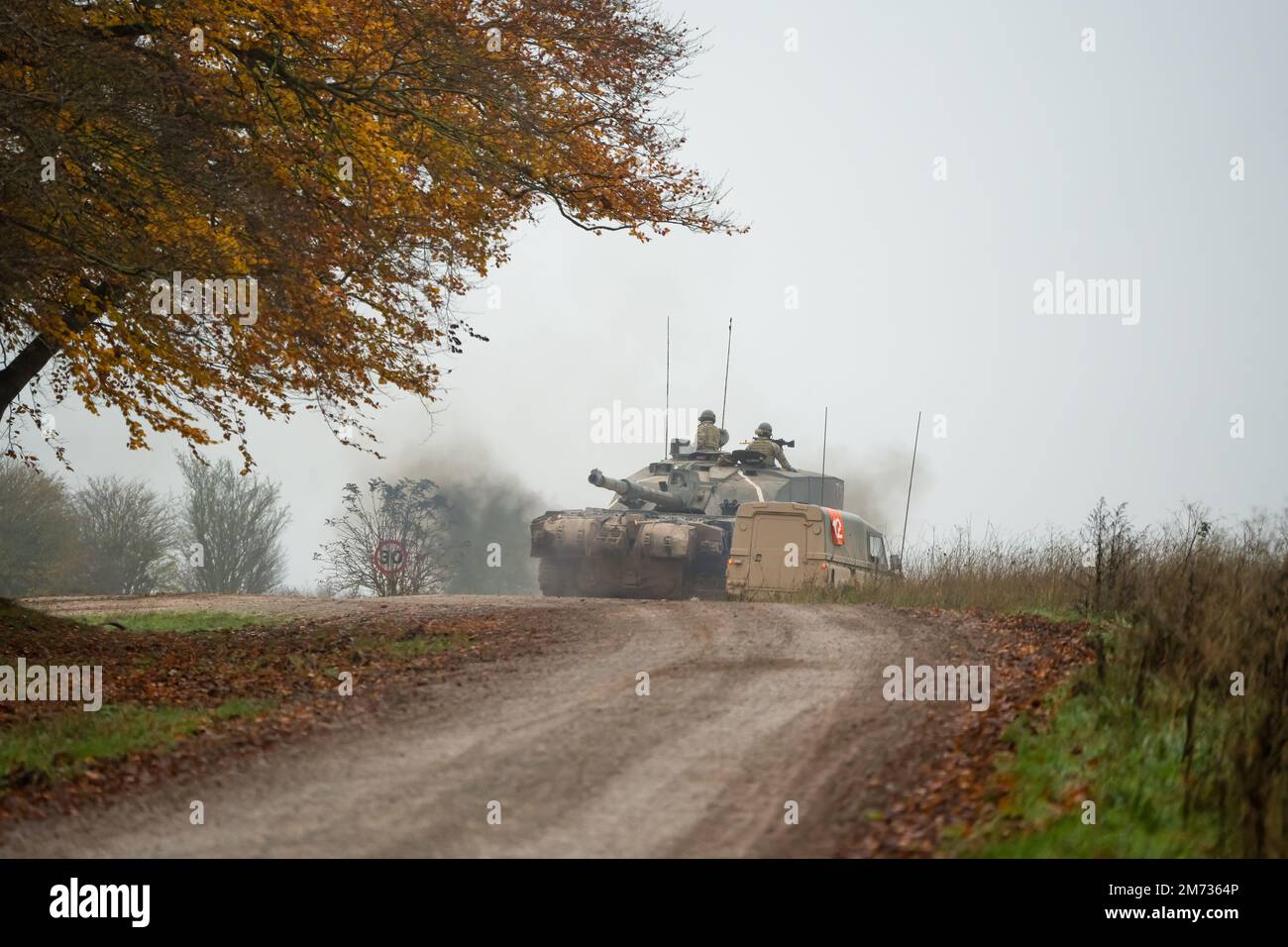 rear three-quarter view of a commander and gunner directing action on a ...