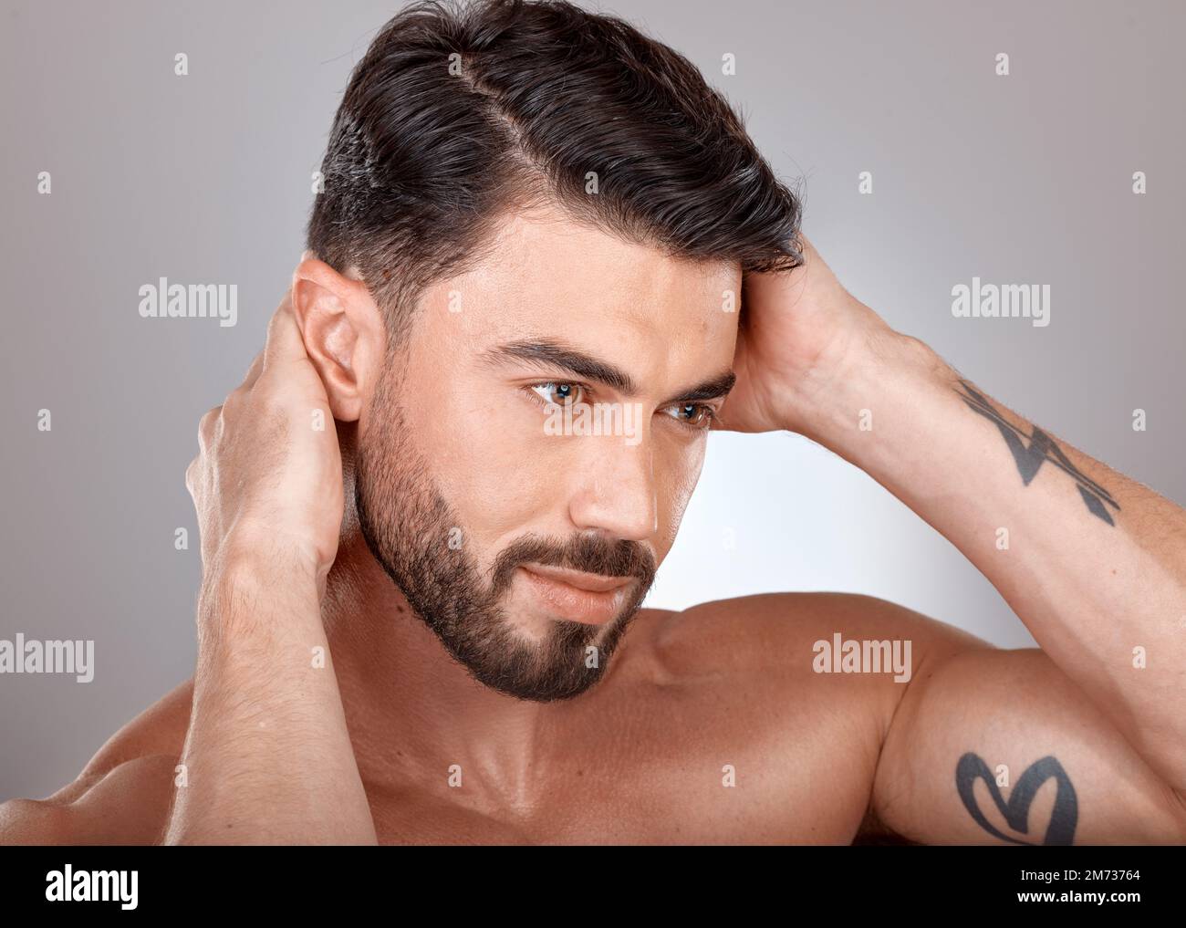 Face, beauty and a man with clean, glow and healthy skin on a grey ...