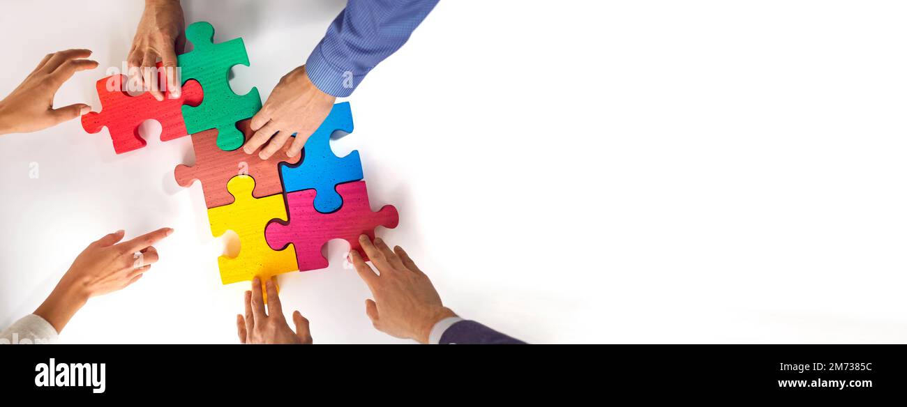 Banner background with business team matching jigsaw puzzle parts to ...