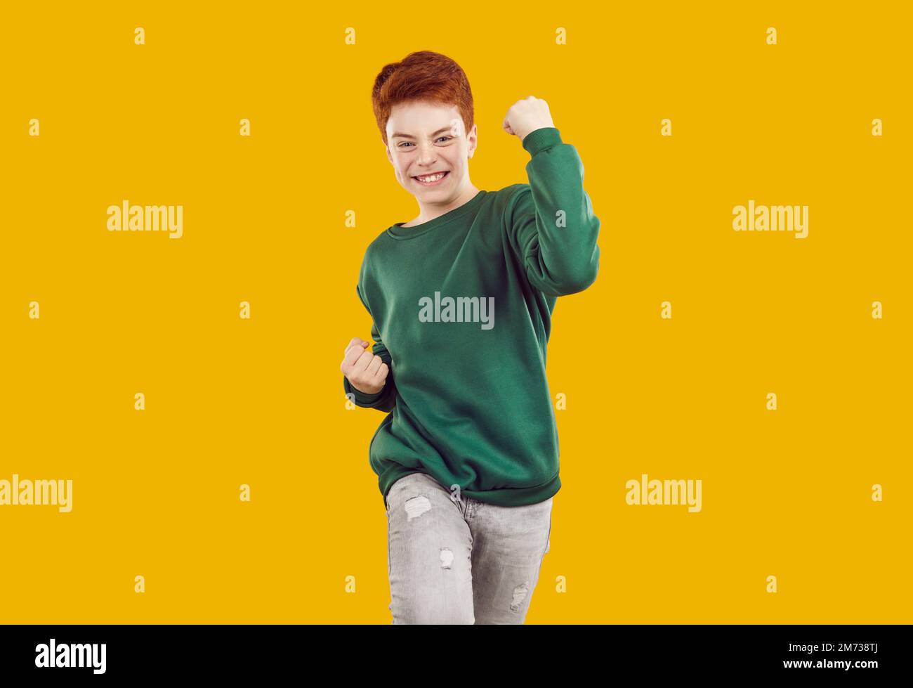 Happy standing isolated on orange background, celebrating success and ...