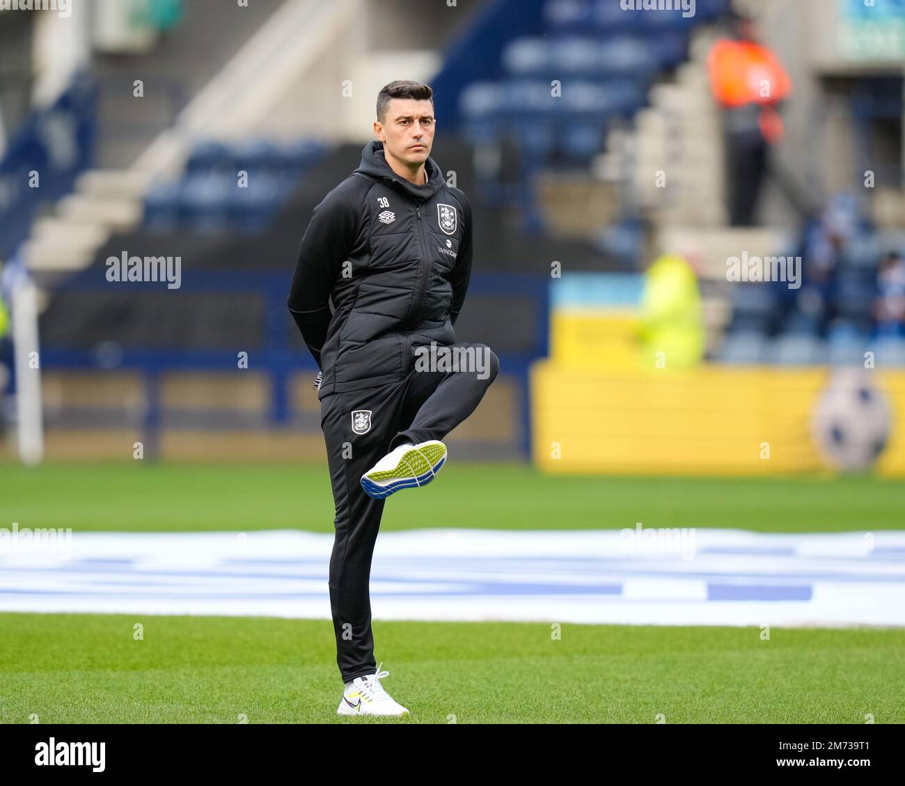 Matt Lowton #38 of Huddersfield Town inspects the pitch before the ...