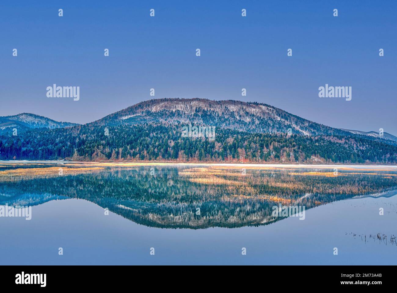 Cloudless weather with magic reflection at a lake Stock Photo - Alamy