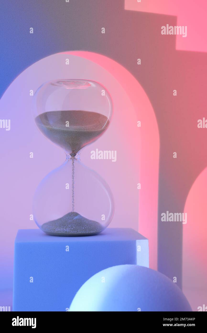 Hourglass on podium. Surreal arches in pink and purple neon lights ...