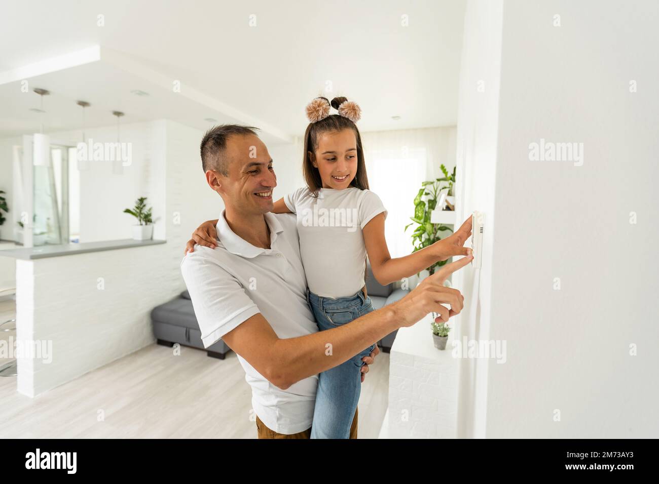 Controlling home heating temperature with a smart home, close-up on ...