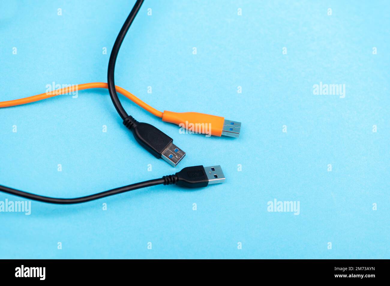 Multicolored computer cable USB isolated on blue background Stock Photo ...
