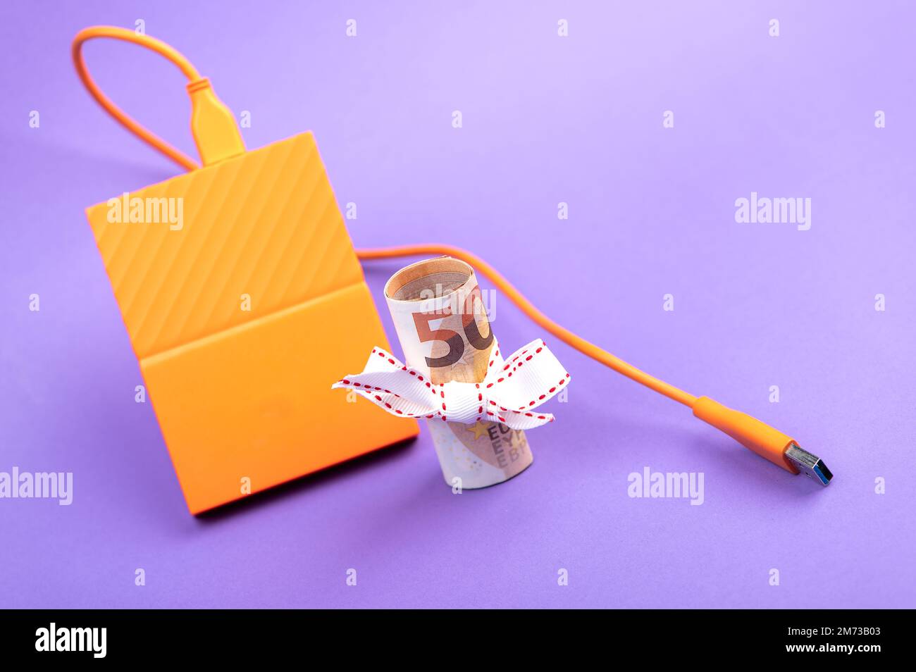 fifty euro banknote money roll and external portable hard disk drives ...