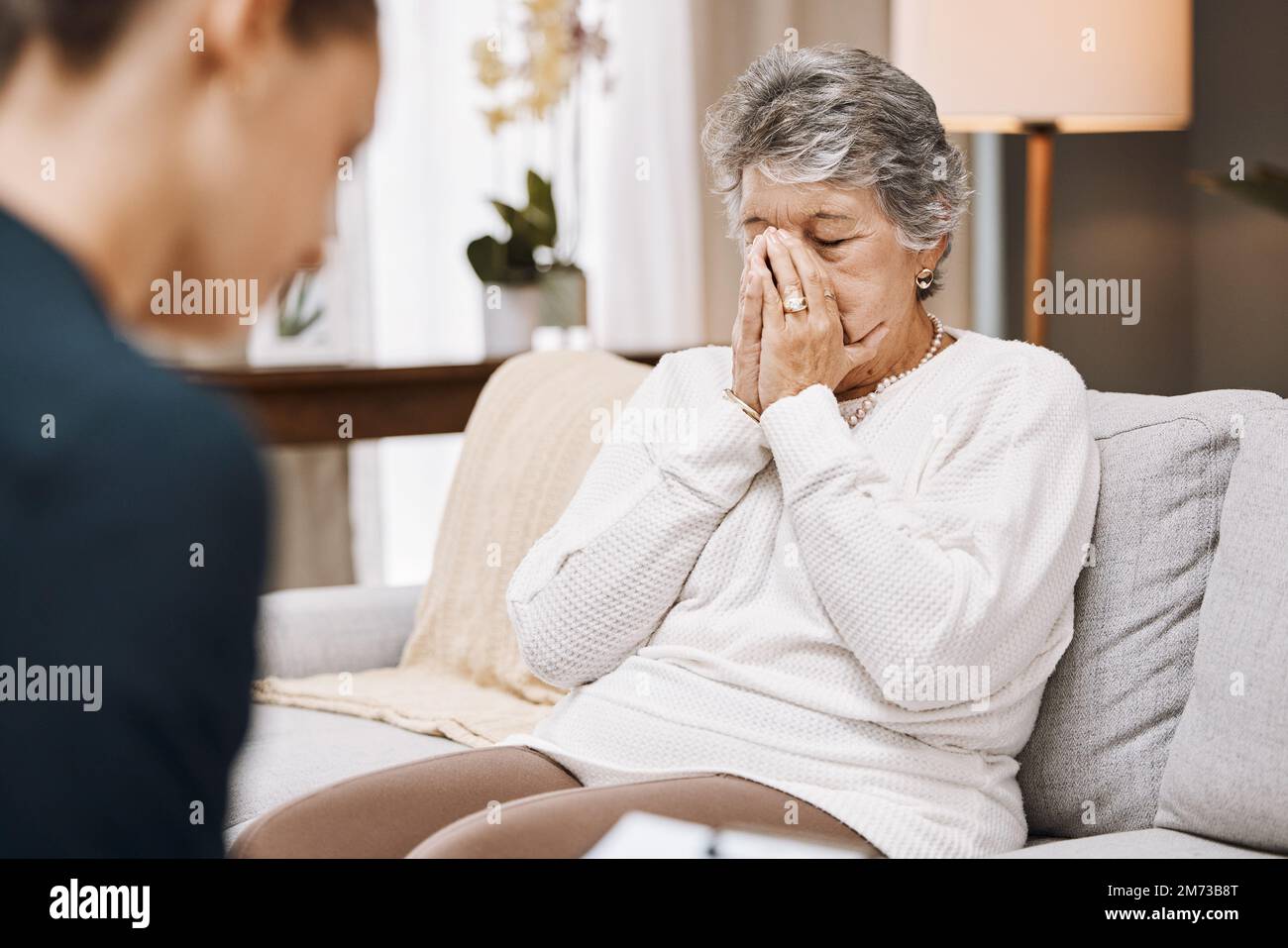 Psychologist, consulting or old woman crying in counseling with ...