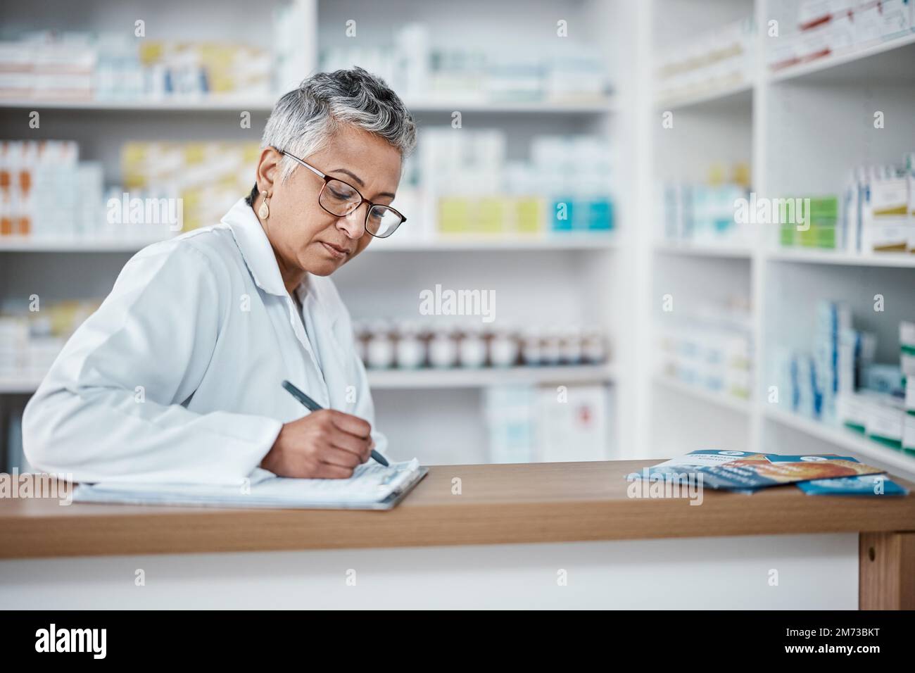 Pharmacy, woman and checklist on clipboard, paperwork and inventory ...