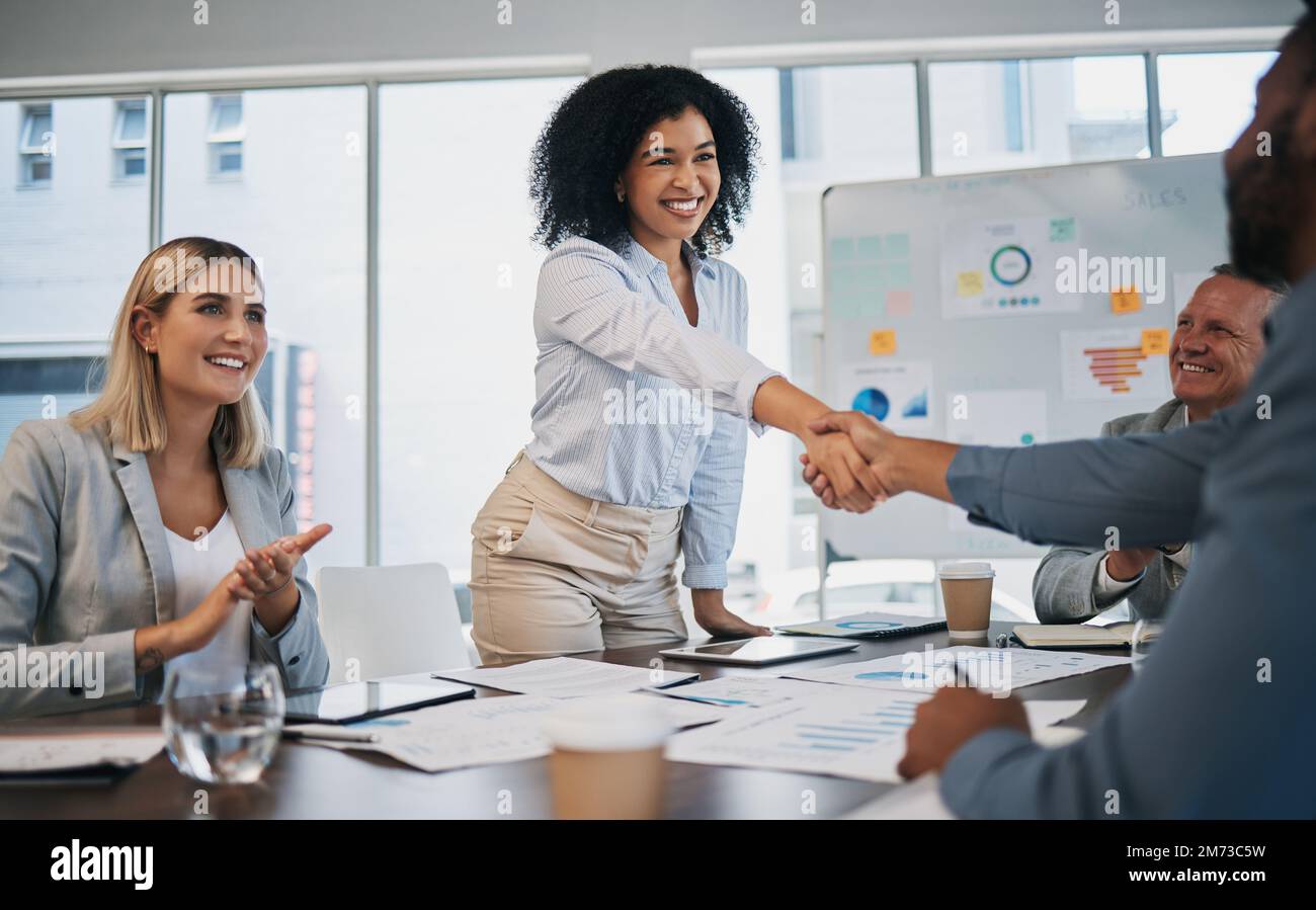 Business people, woman and handshake at meeting, planning and chart on board for target, success ...