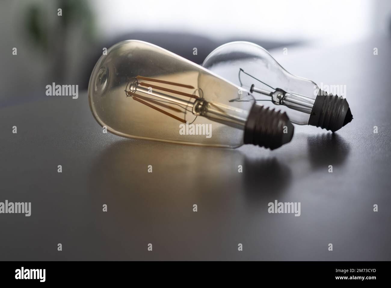 Alternative technology concept . Bulb and Fluorescent bulb comparing ...
