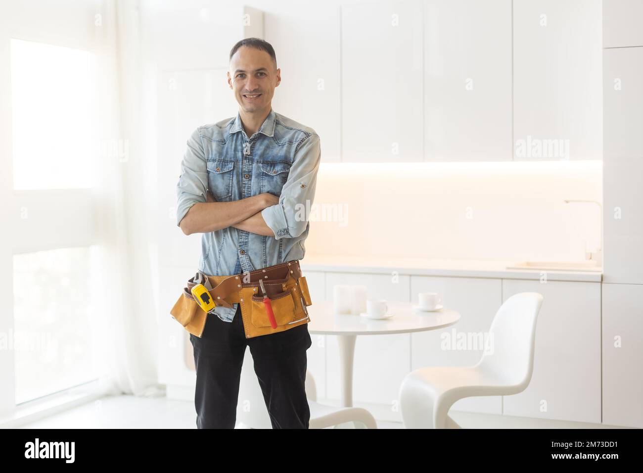 handyman with tool belt with construction tools Stock Photo - Alamy