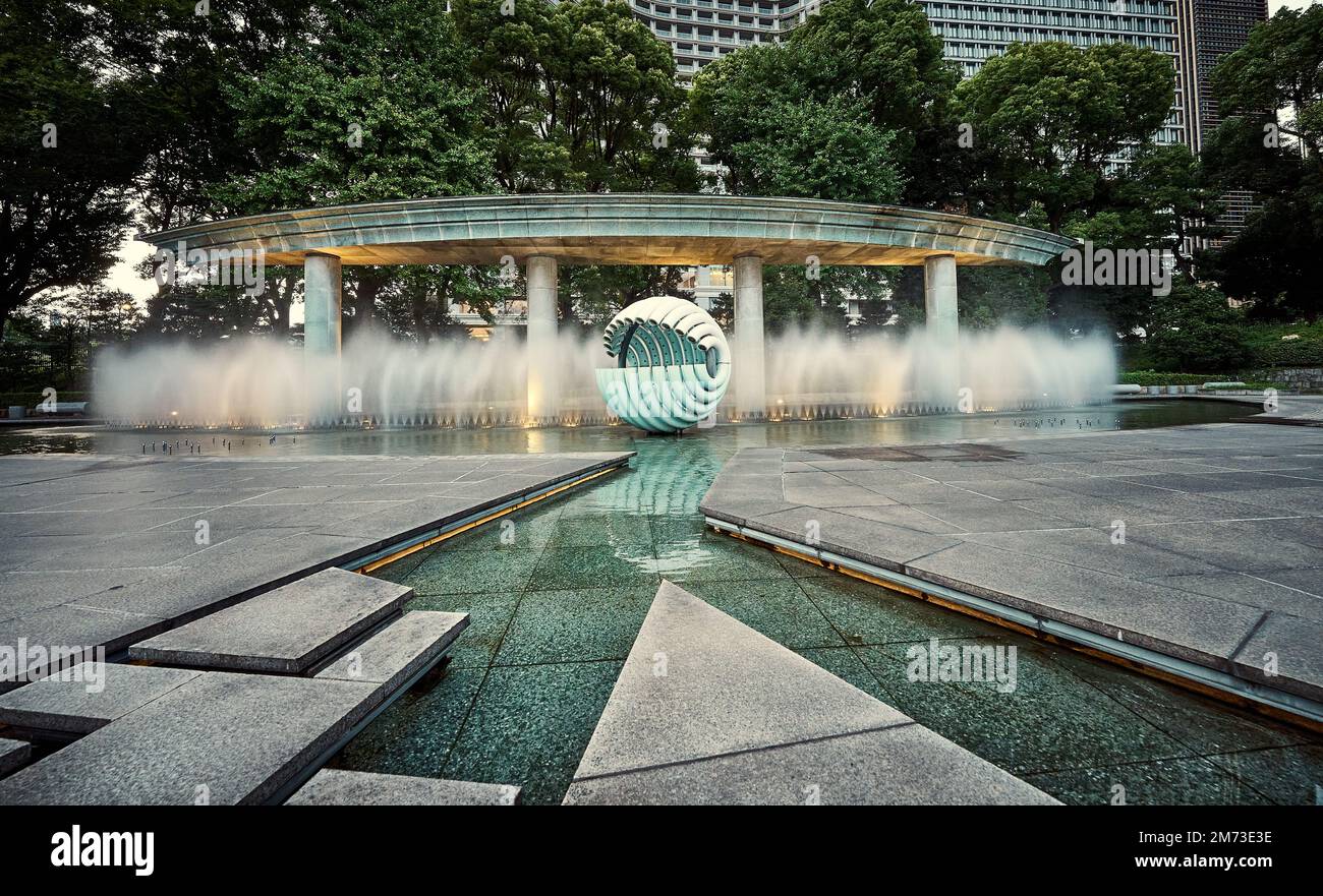 A beautiful shot of city park with sculpture and fountains in Tokyo ...
