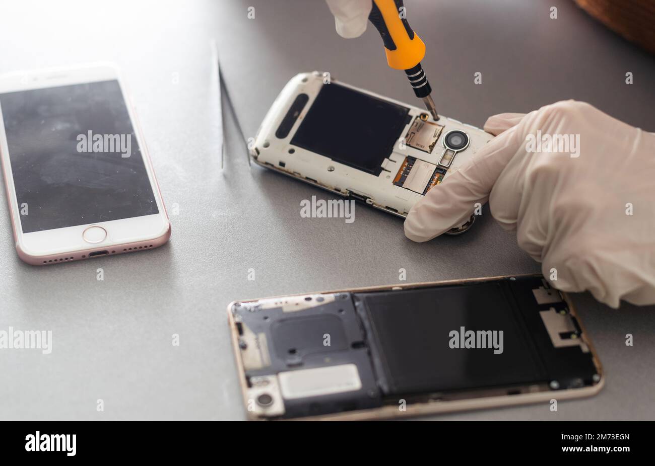 Close-up photos showing process of mobile phone repair Stock Photo - Alamy