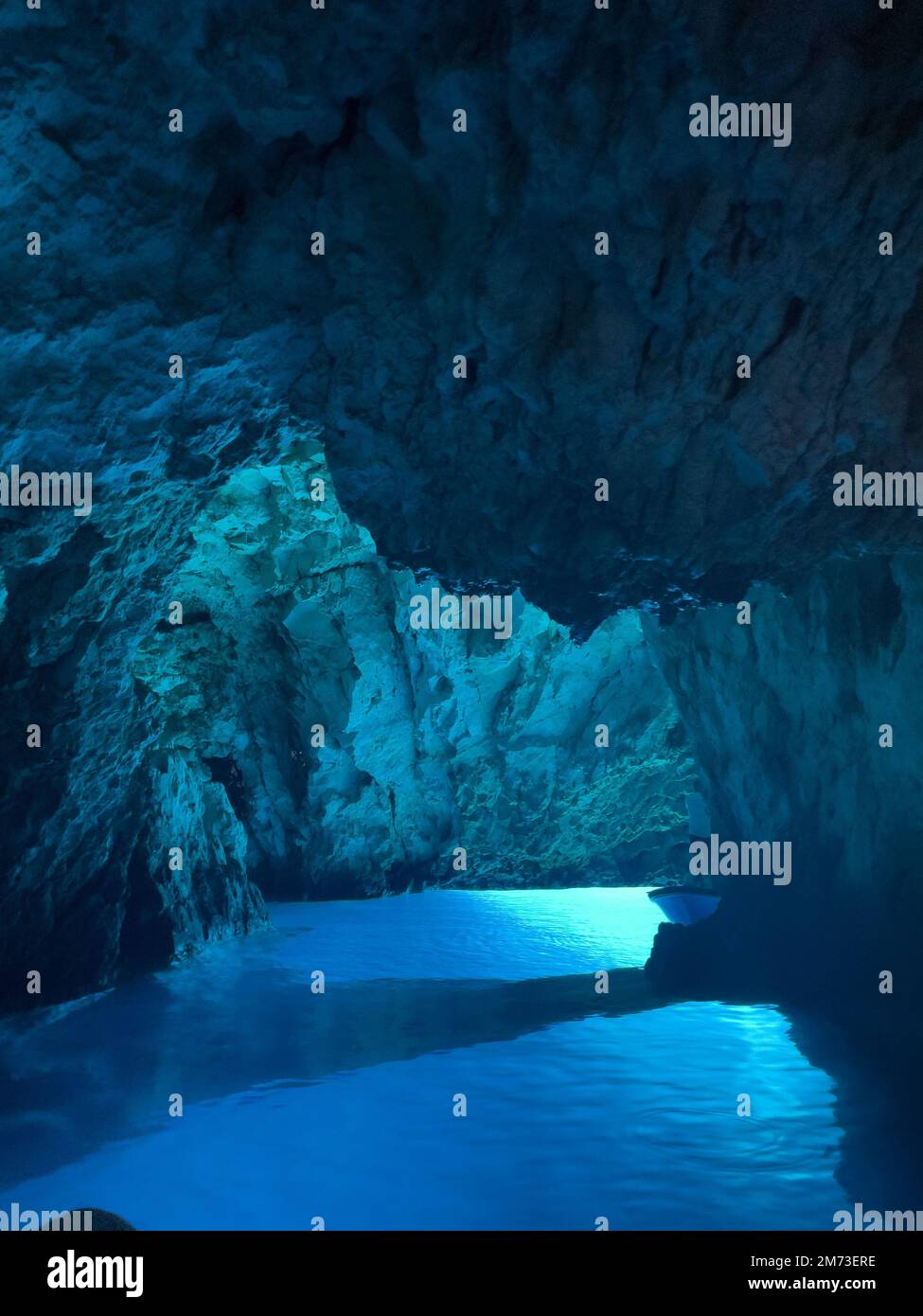 A vertical shot of the Blue Cave in the Croatian Adriatic Stock Photo ...