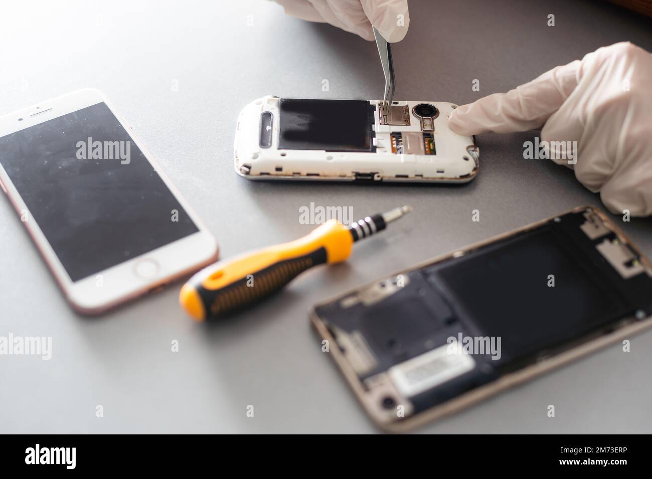 Close-up photos showing process of mobile phone repair Stock Photo - Alamy