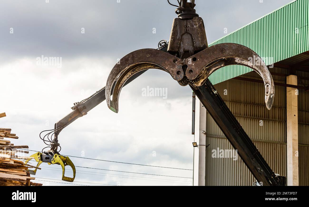 Log loader in detail. Lumber industry Stock Photo - Alamy