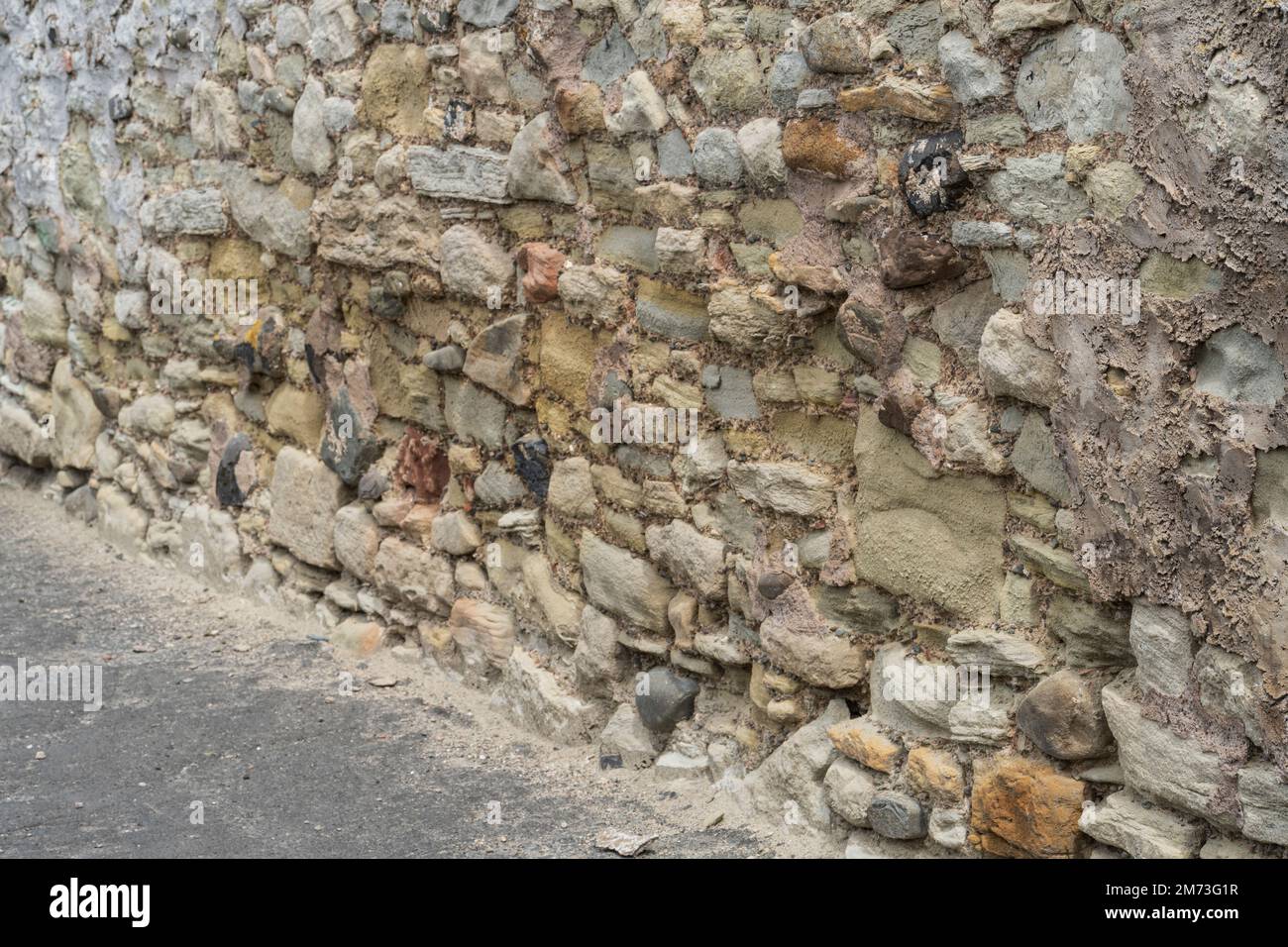 Roadside sandstone wall in southern Scotland eroded because of traffic ...