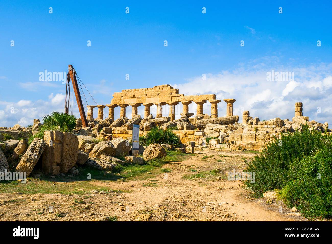 Remains of an ancient doric column and the view of the Mediterranean ...