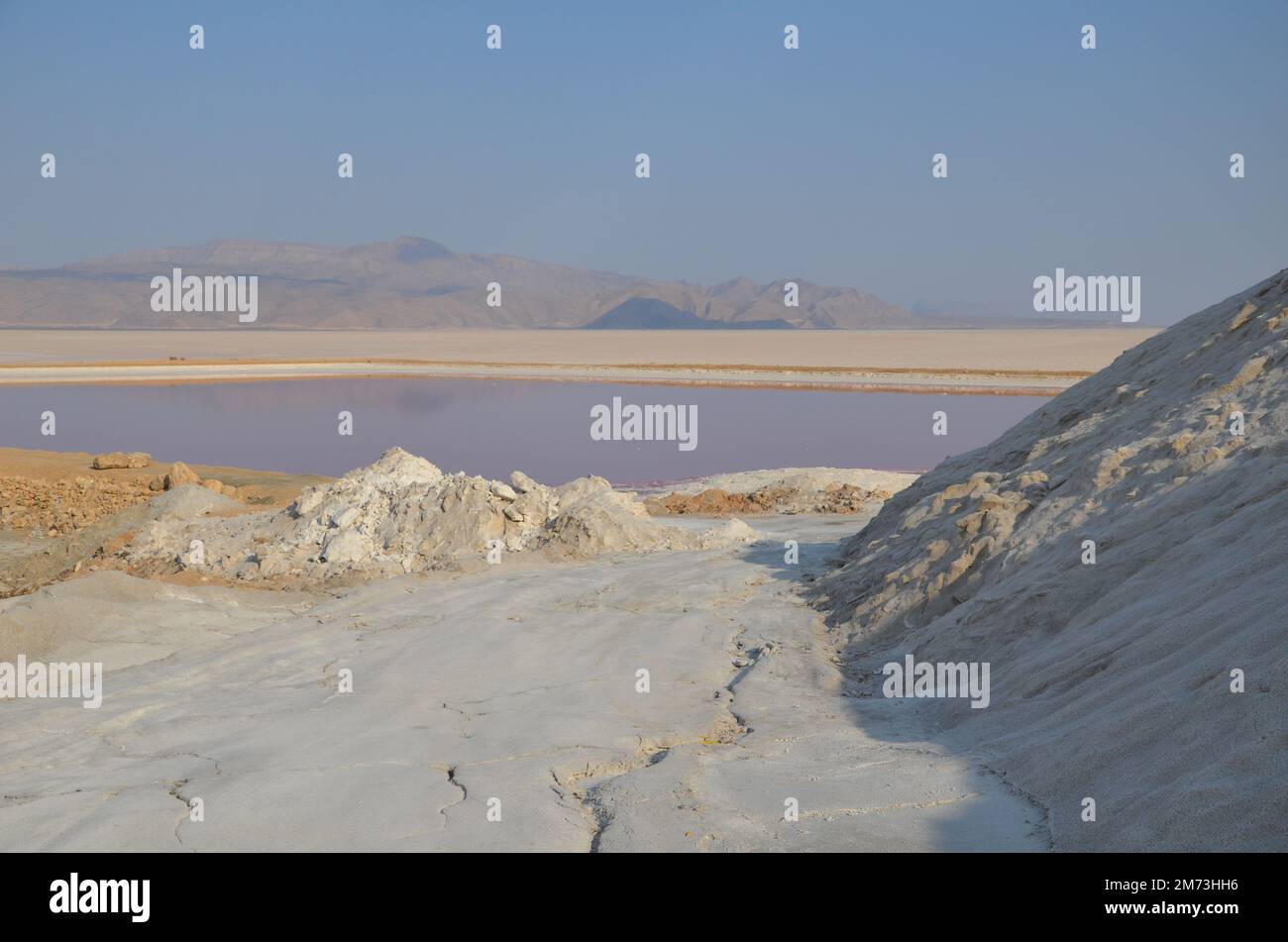 salt hills at the shore of pink lake near Shiraz, Iran Stock Photo - Alamy