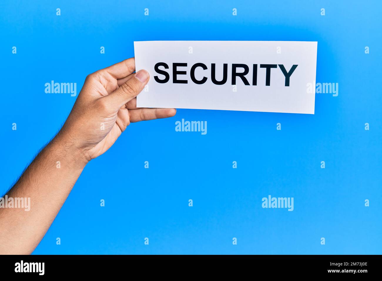 Hand of caucasian man holding paper with security word over isolated ...