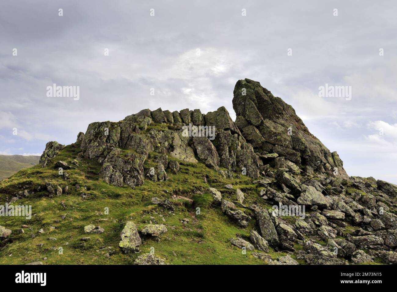 The summit of Helm Crag fell, above Grasmere in the Central Fells, Lake ...