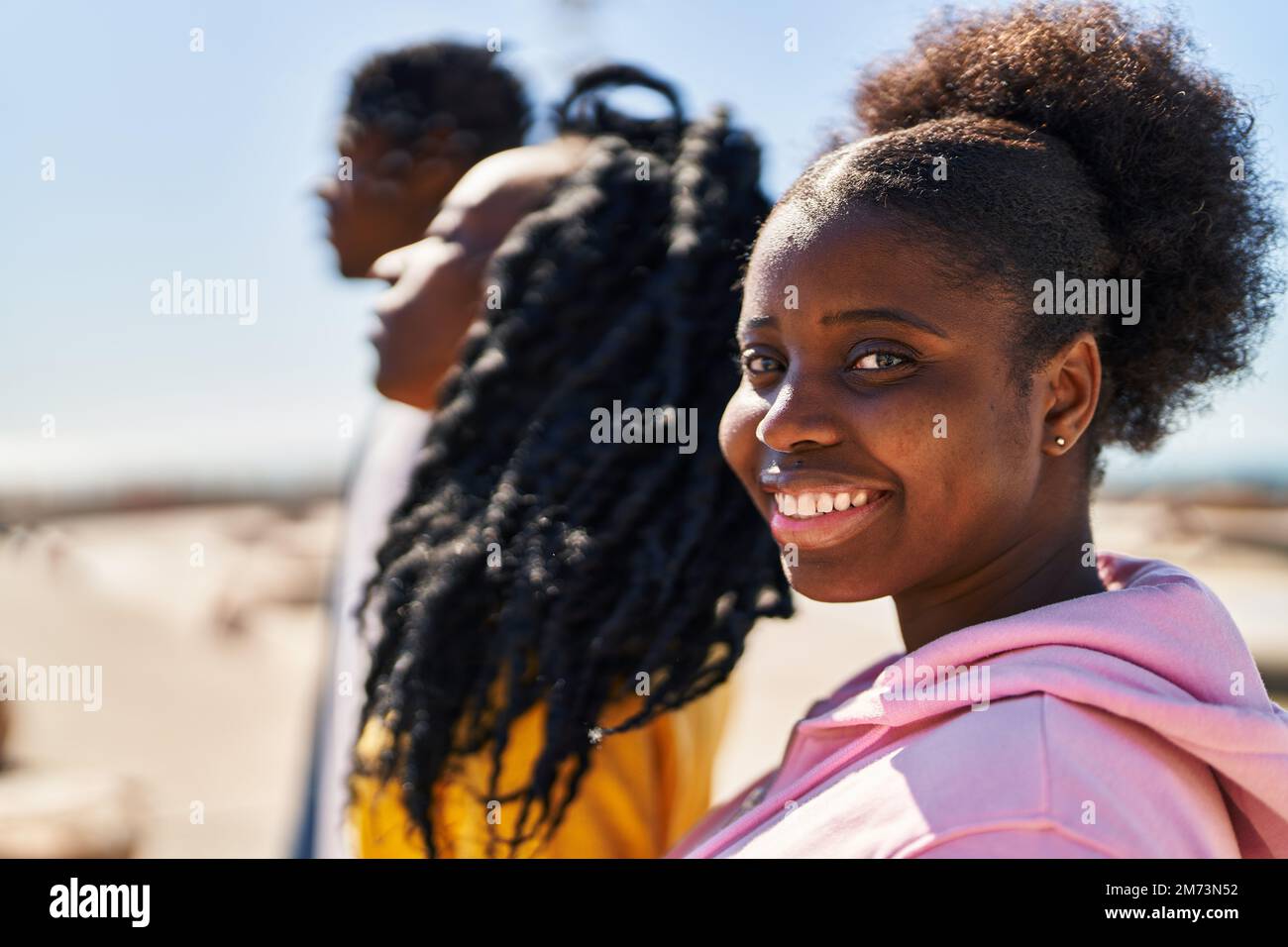African american friends smiling confident standing together at seaside ...