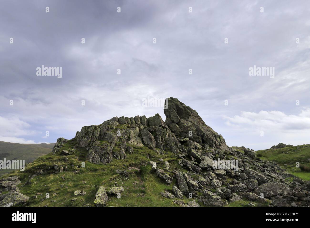 The summit of Helm Crag fell, above Grasmere in the Central Fells, Lake ...